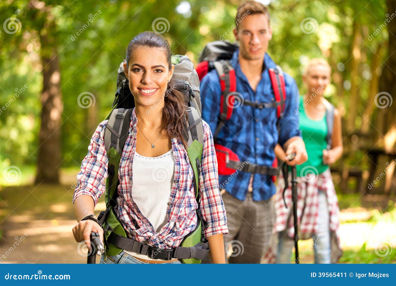 Three friends hiking stock image. Image of hike, forest - 39565411