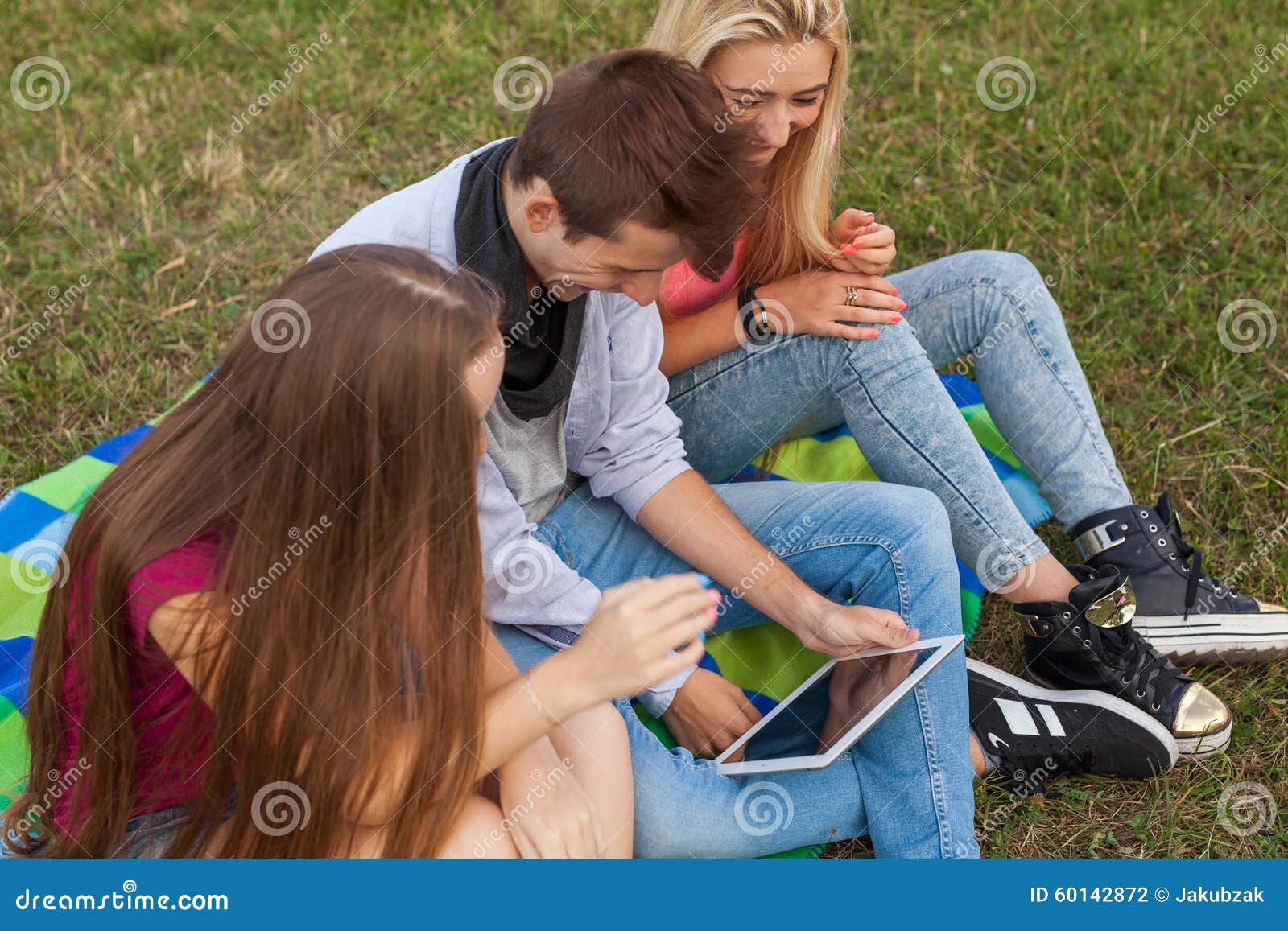 Three Friends Playing Game on Tablet Pc. they Winning Again. Stock ...