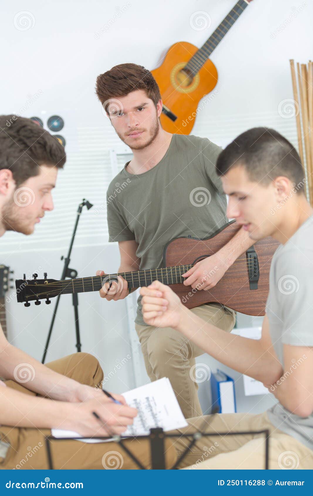Three Friends Playing Instruments at Home Stock Photo - Image of three ...