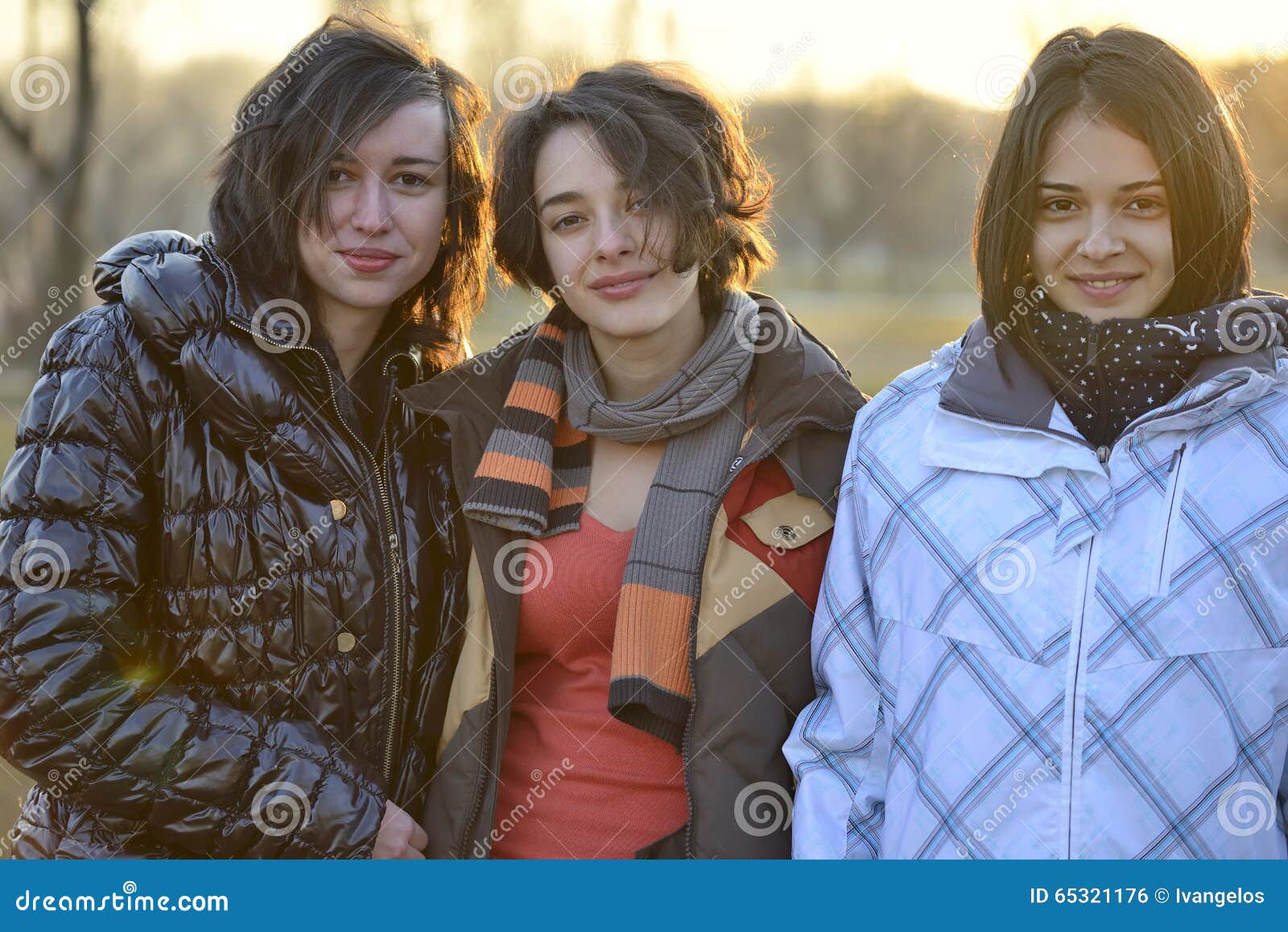 Three Friends Standing Together during Sunset Stock Photo - Image of ...
