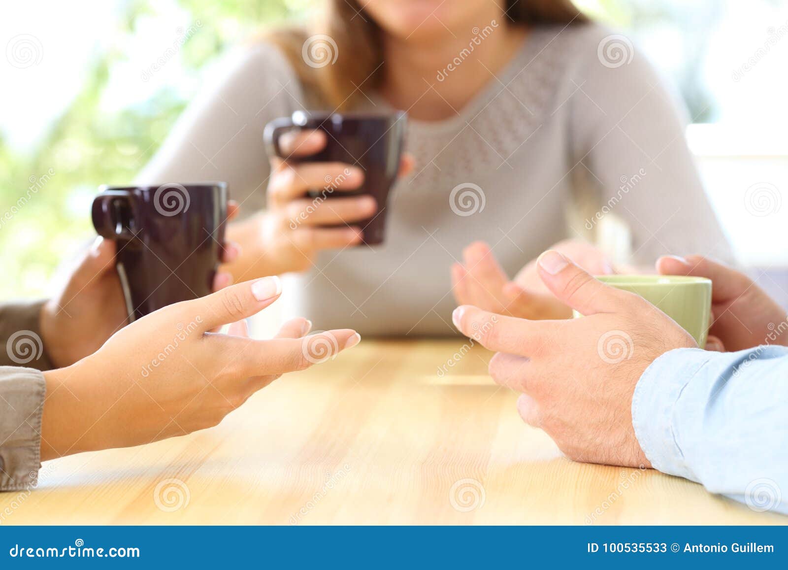 Three Friends Talking and Holding Coffee Cups Stock Image - Image of ...