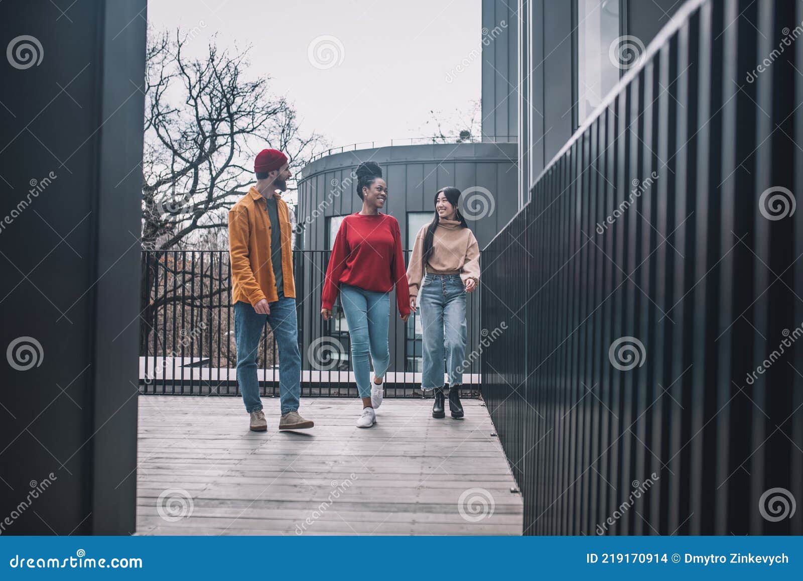 Three Friends Walking Together and Feeling Good Stock Photo - Image of ...