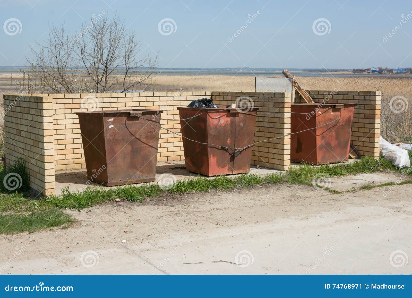 Three Garbage Tank Linked Metal Cable Are At The Designated Place And ...