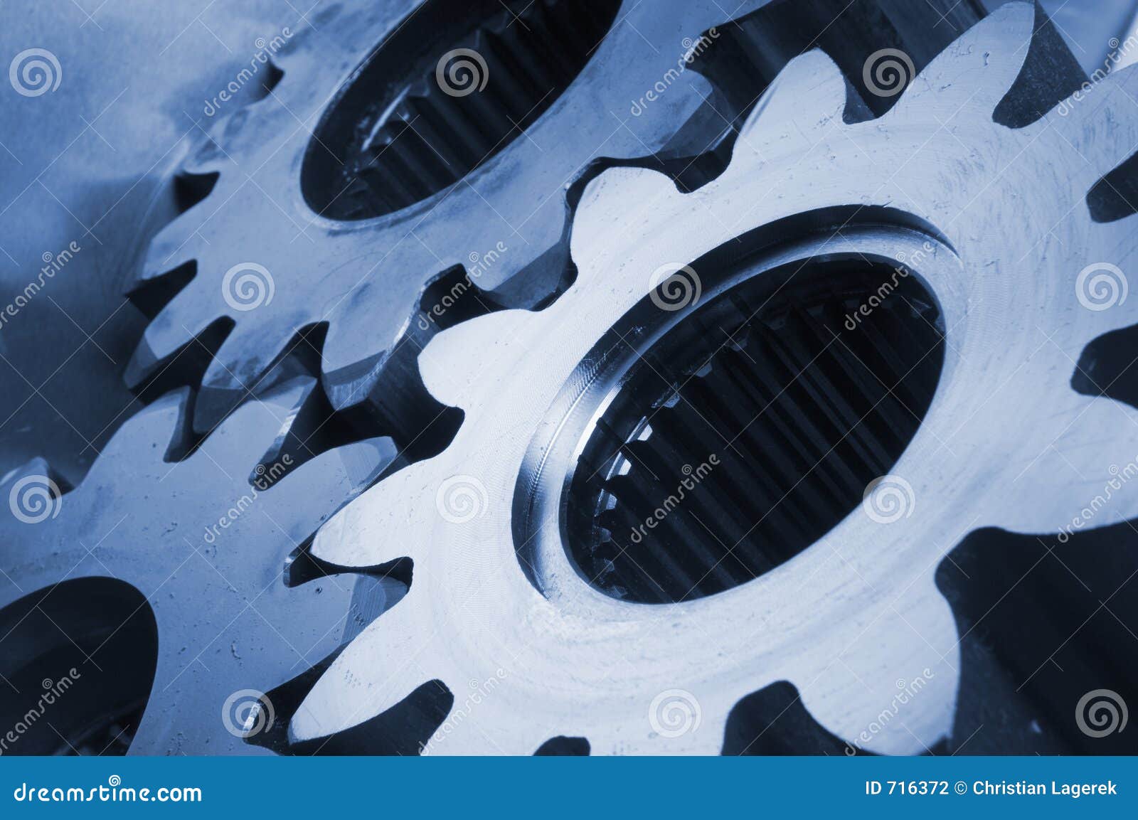 Three gear-wheels in blue stock photo. Image of gears, mechanical - 716372