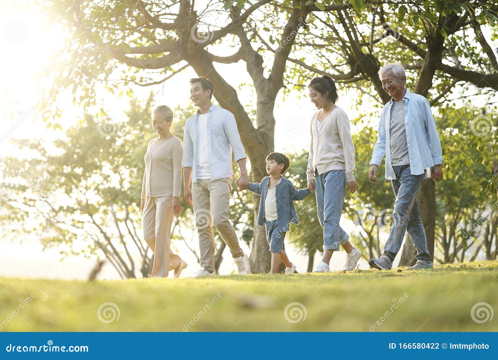 Three Generation Asian Family Walking in Park Stock Photo - Image of ...