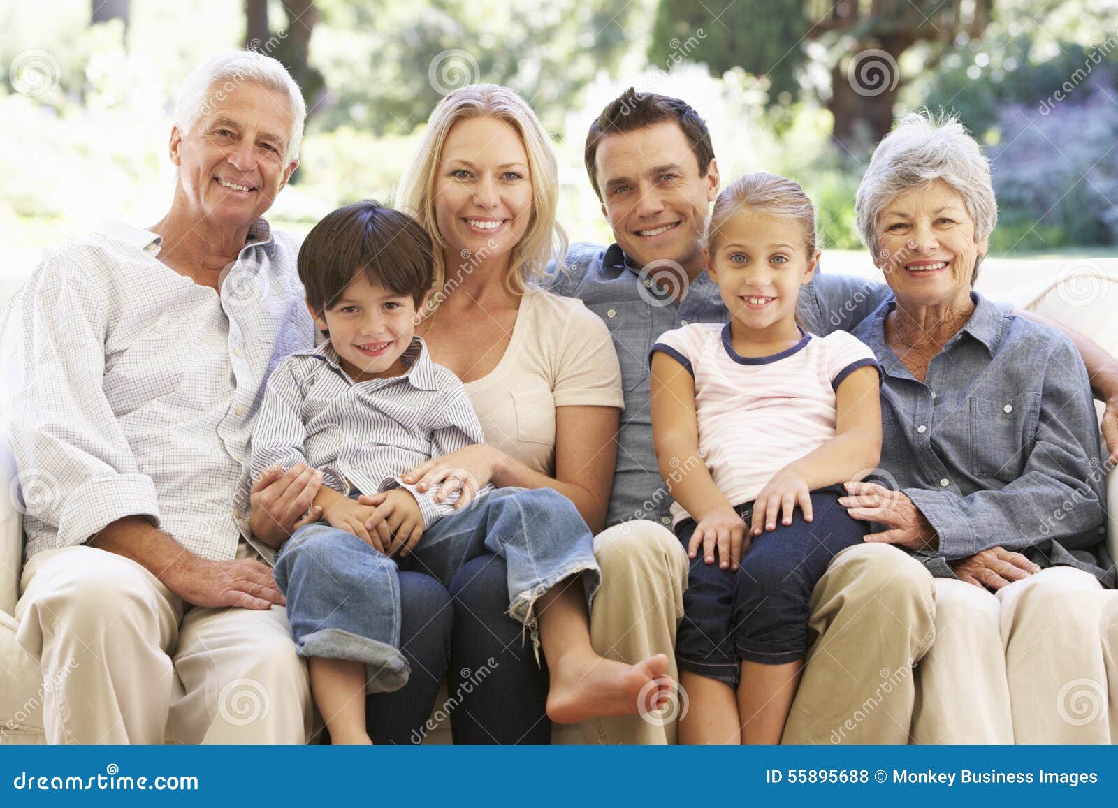 Three Generation Family Sitting on Sofa at Home Stock Photo - Image of ...