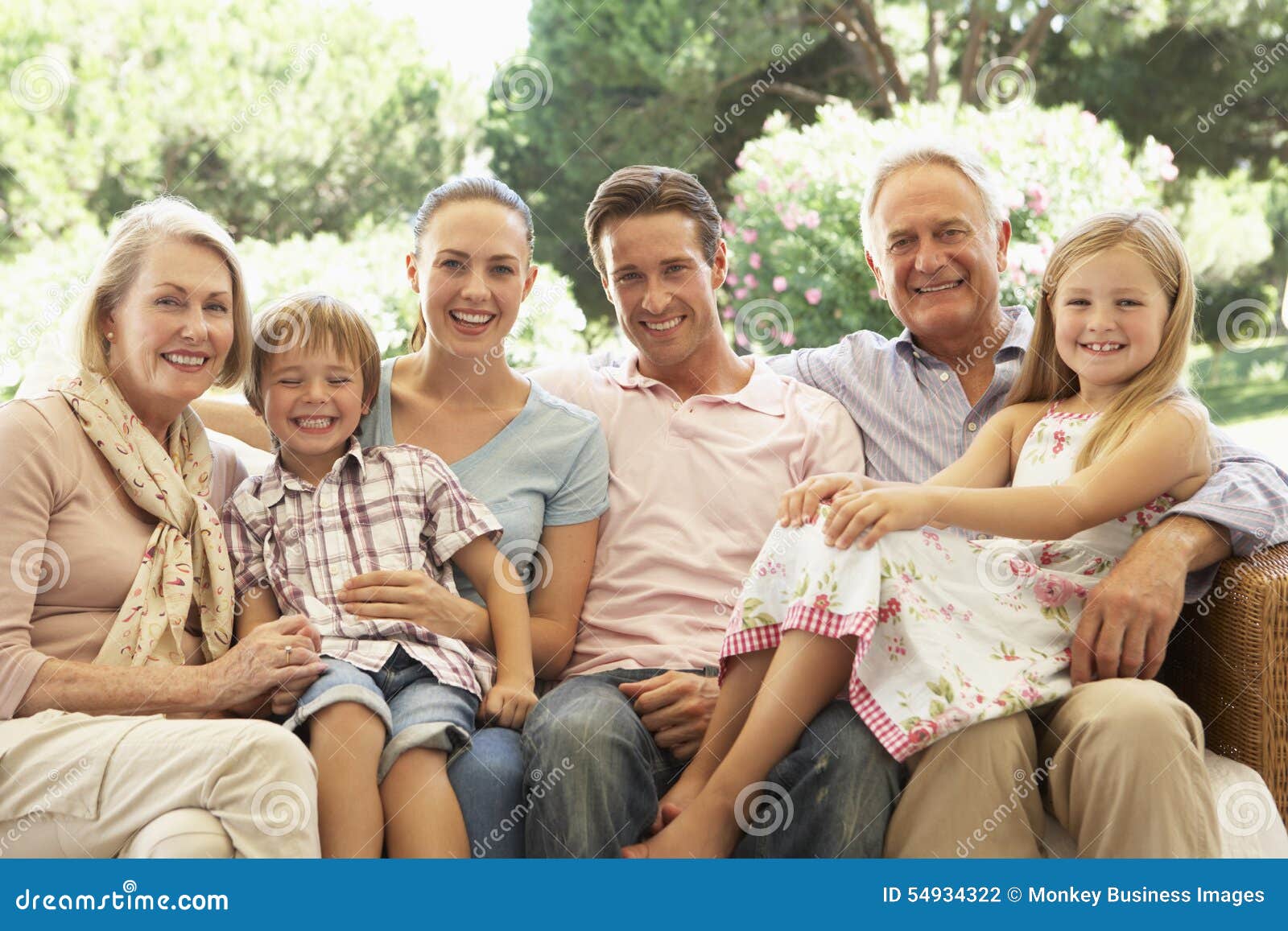 Three Generation Family Sitting on Sofa Together Stock Photo - Image of ...