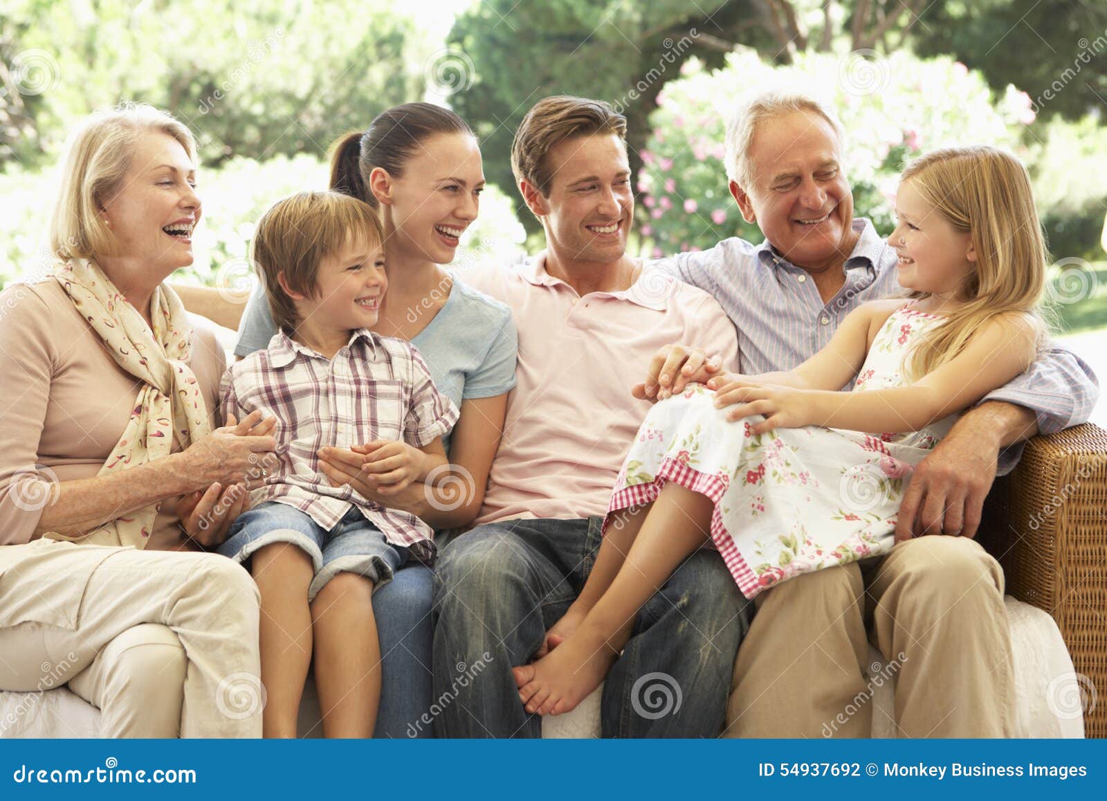 Three Generation Family Sitting on Sofa Together Stock Photo - Image of ...