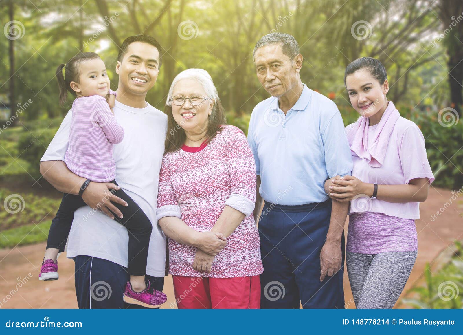 Three Generation Family Standing in the Park Stock Photo - Image of ...