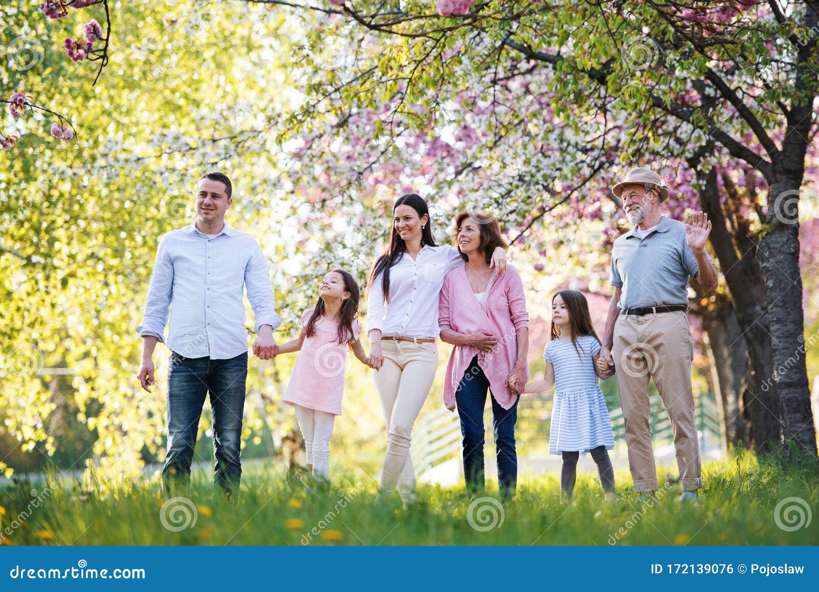 Three Generation Family Walking Outside in Spring Nature. Stock Photo ...