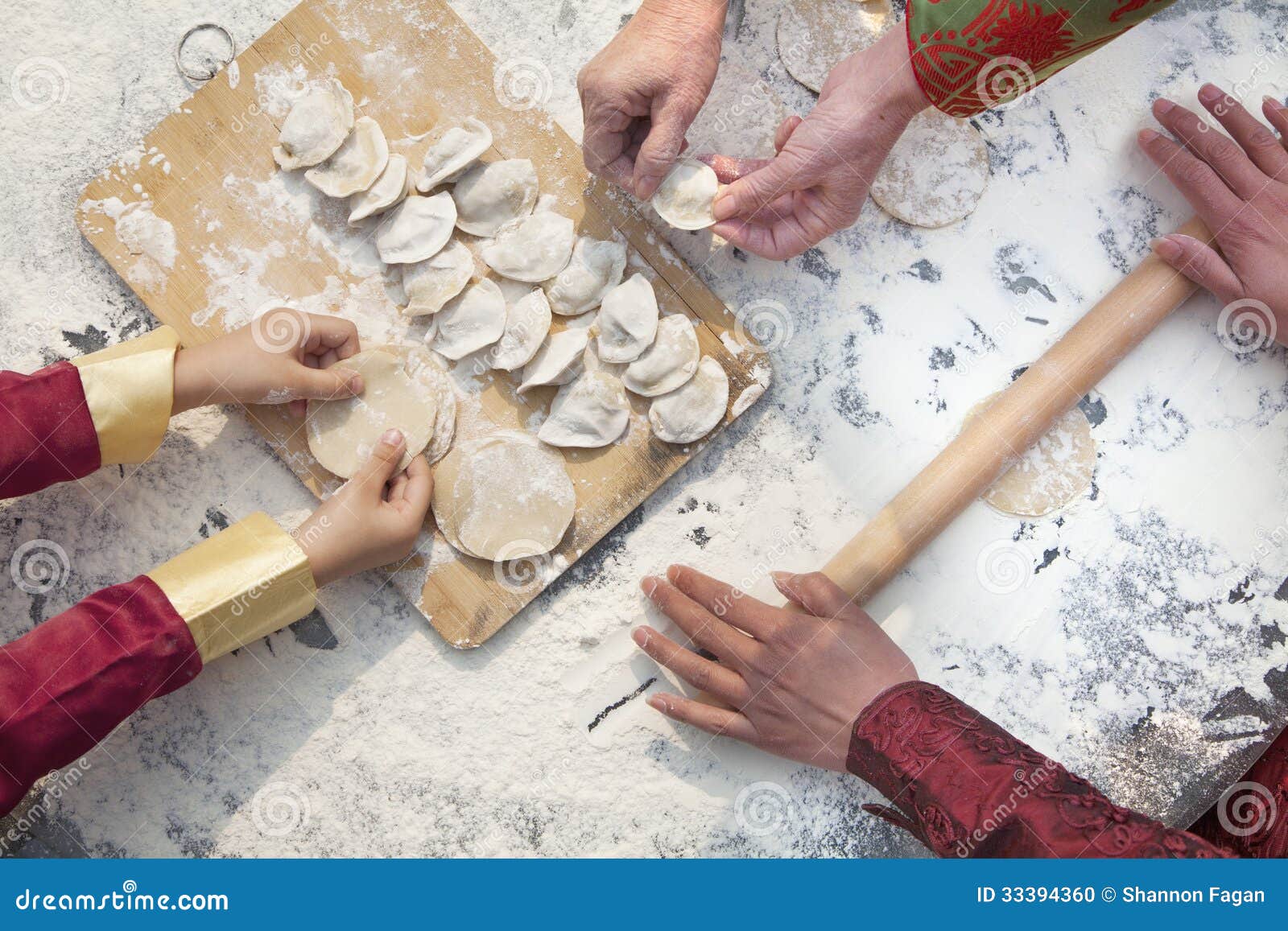 Three Generation Of Women Making Dumplings, Hands Only Royalty-Free ...
