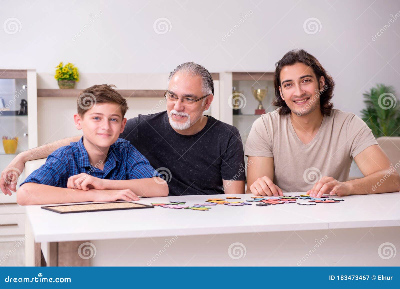 Three Generations of Family Playing Jigsaw Puzzle Game Stock Image ...