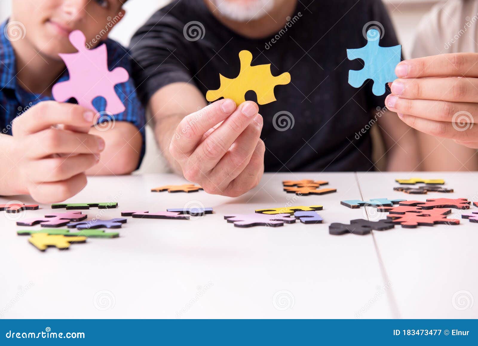 Three Generations of Family Playing Jigsaw Puzzle Game Stock Image ...