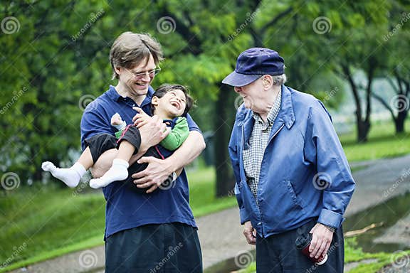 Three Generations Interacting Together Stock Photo - Image of holding ...