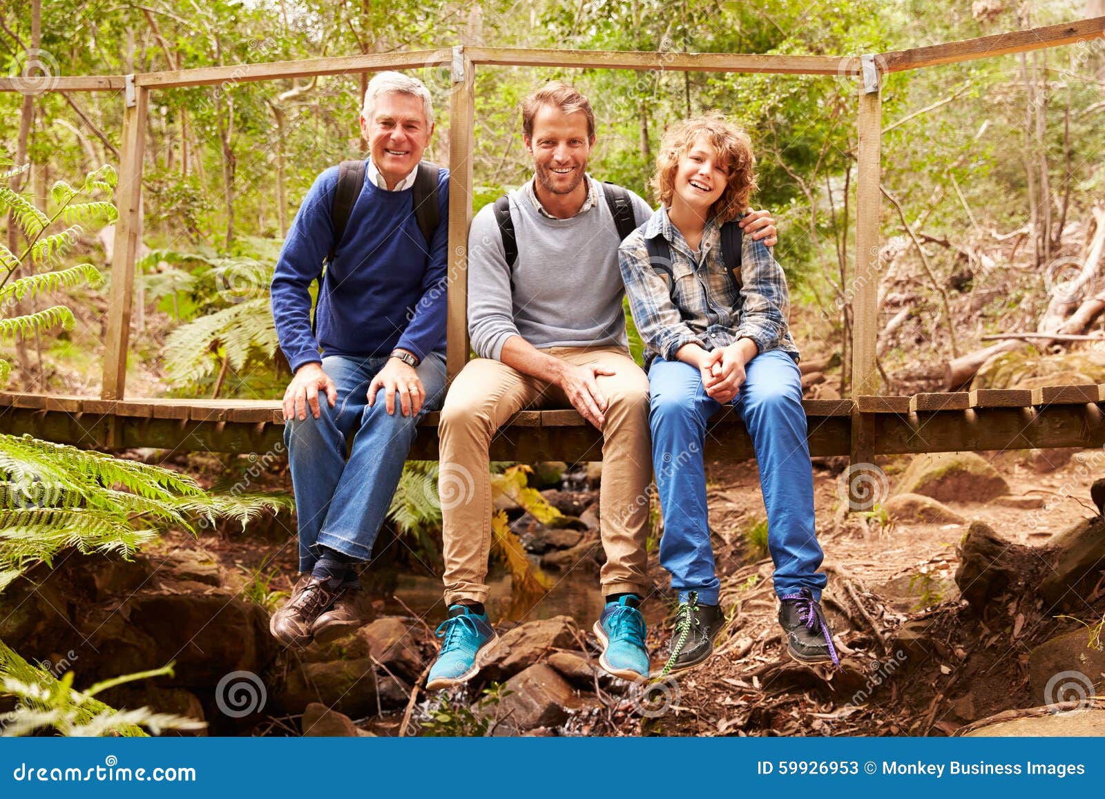 Three Generations of Men on a Bridge in a Forest, Portrait Stock Image ...
