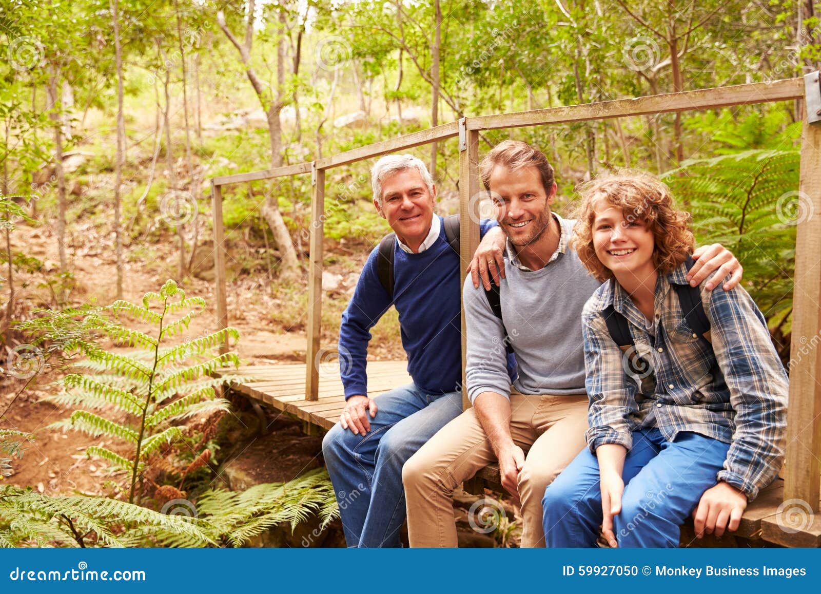 Three Generations of Men on a Bridge in a Forest, Portrait Stock Photo ...
