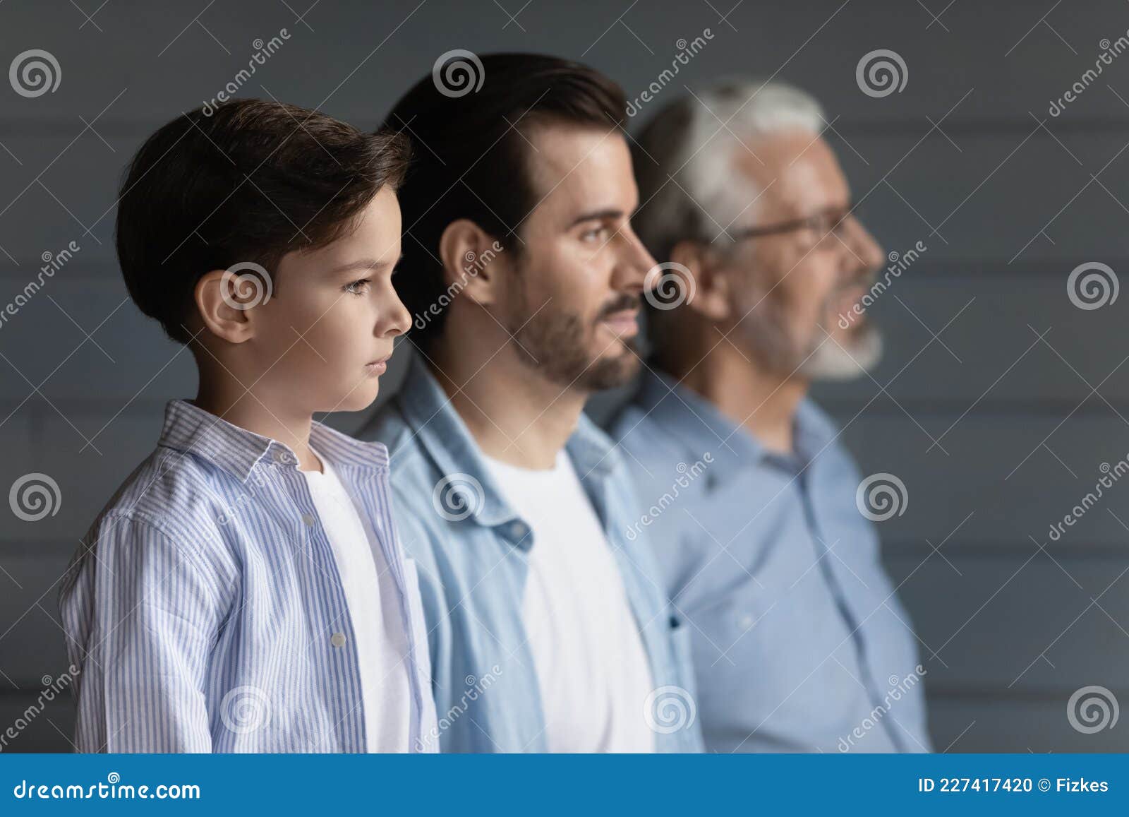 Three Generations of Men Pose Together Showing Unity Stock Photo ...