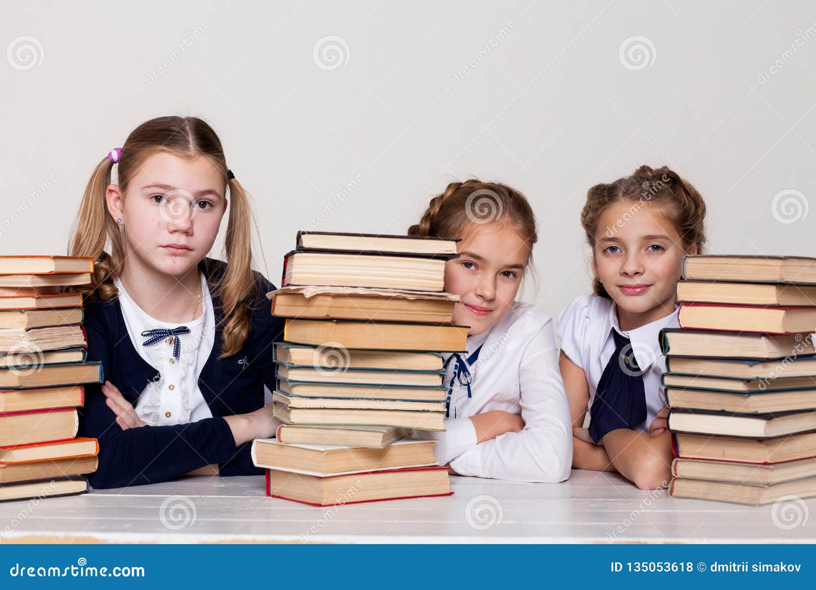 Three Girls in the Classroom Studying Many Books Stock Photo - Image of ...