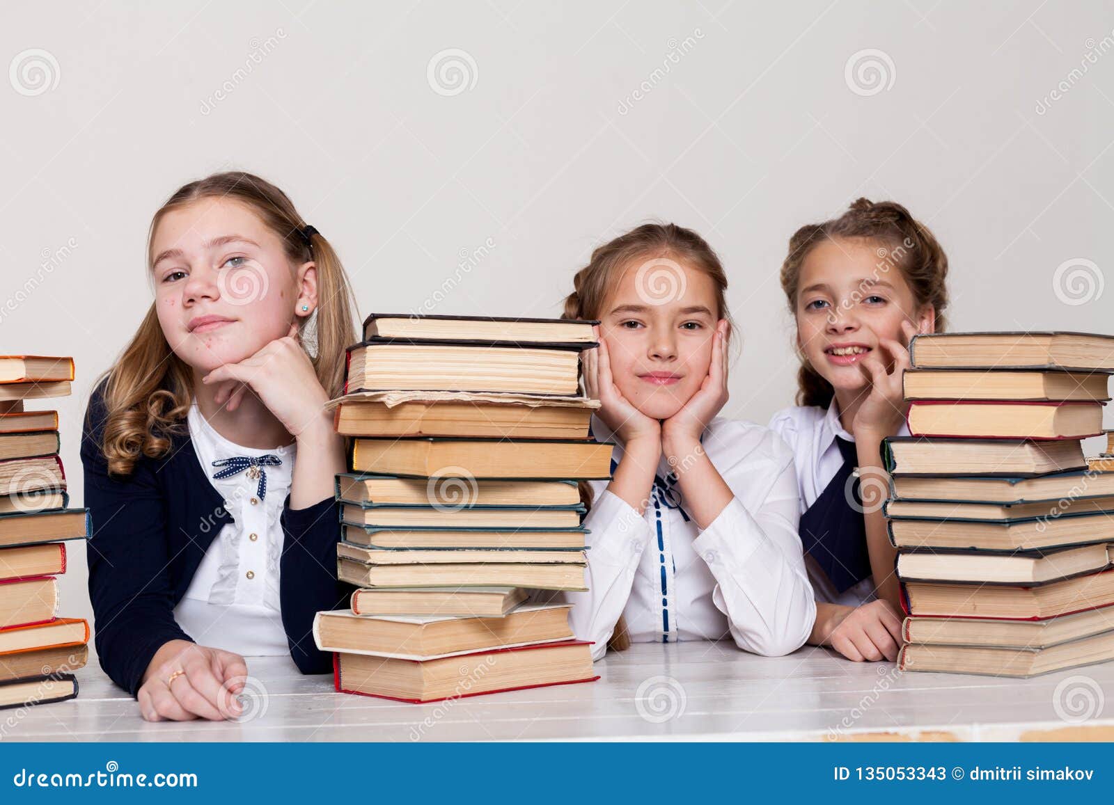Three Girls in the Classroom Studying Many Books Stock Image - Image of ...