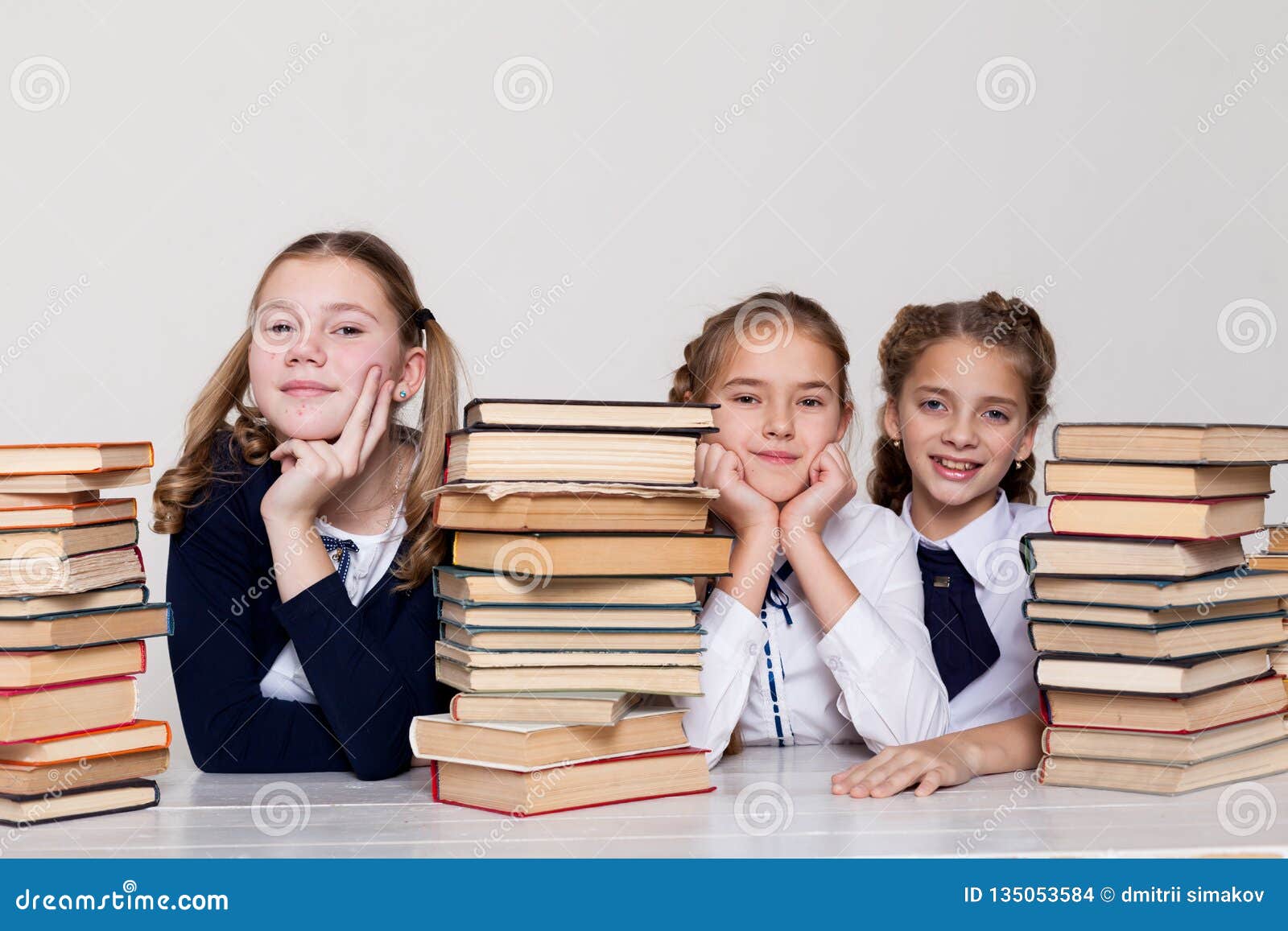 Three Girls in the Classroom Studying Many Books Stock Photo - Image of ...