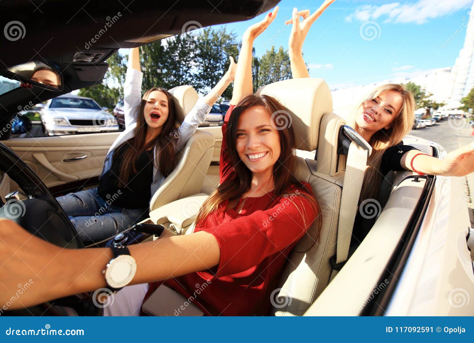 Three Girls Driving in a Convertible Car and Having Fun. Stock Image ...