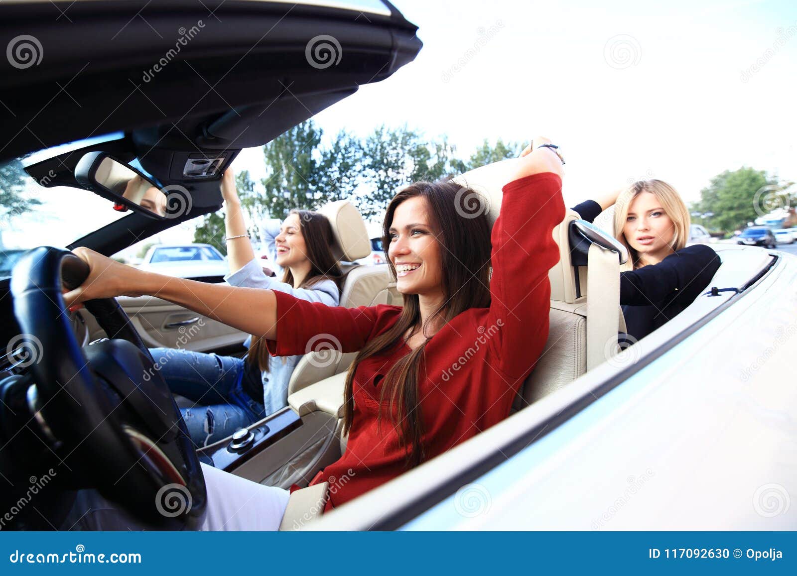 Three Girls Driving in a Convertible Car and Having Fun. Stock Photo ...