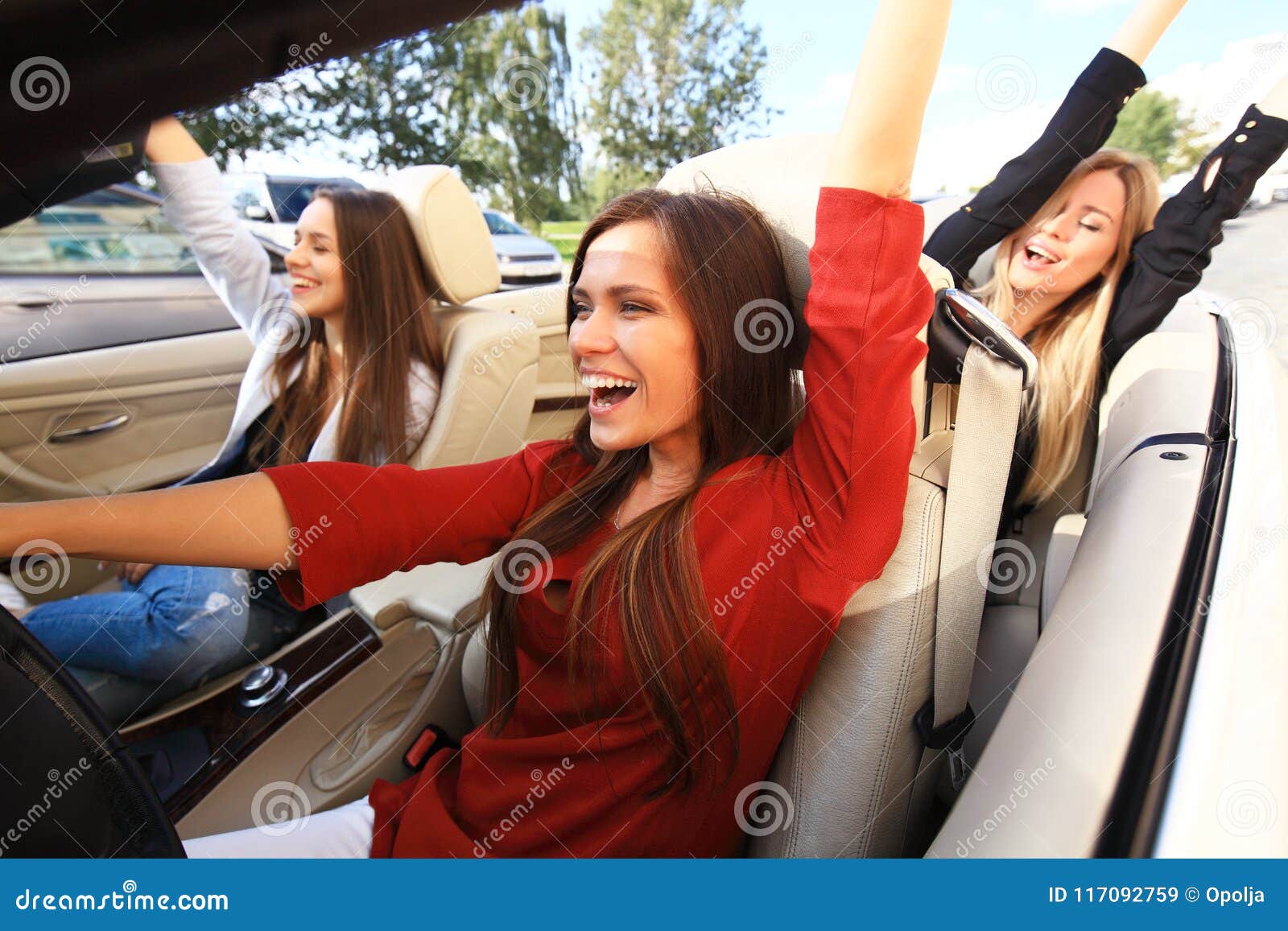 Three Girls Driving in a Convertible Car and Having Fun. Stock Image ...