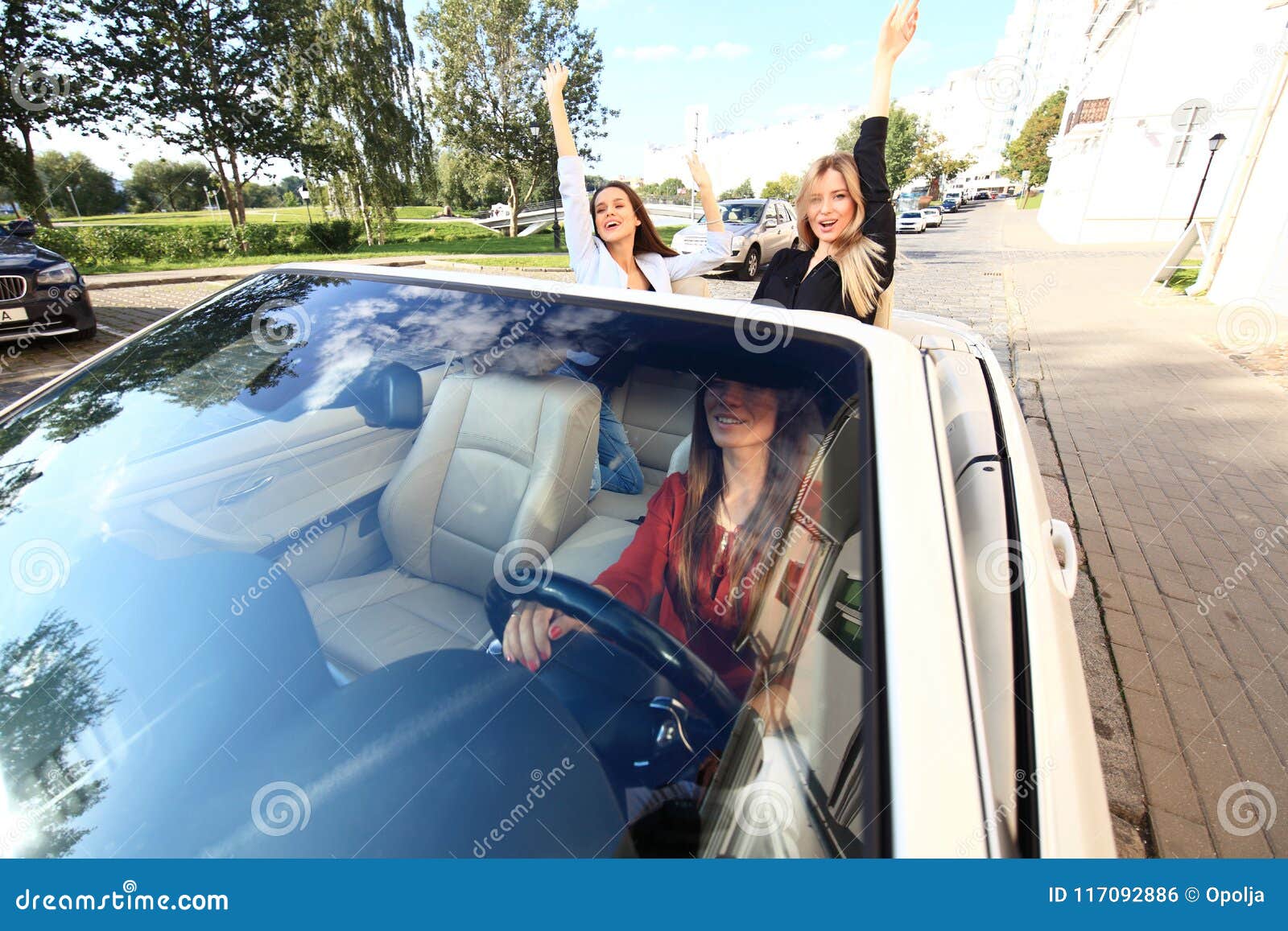 Three Girls Driving in a Convertible Car and Having Fun. Stock Photo ...