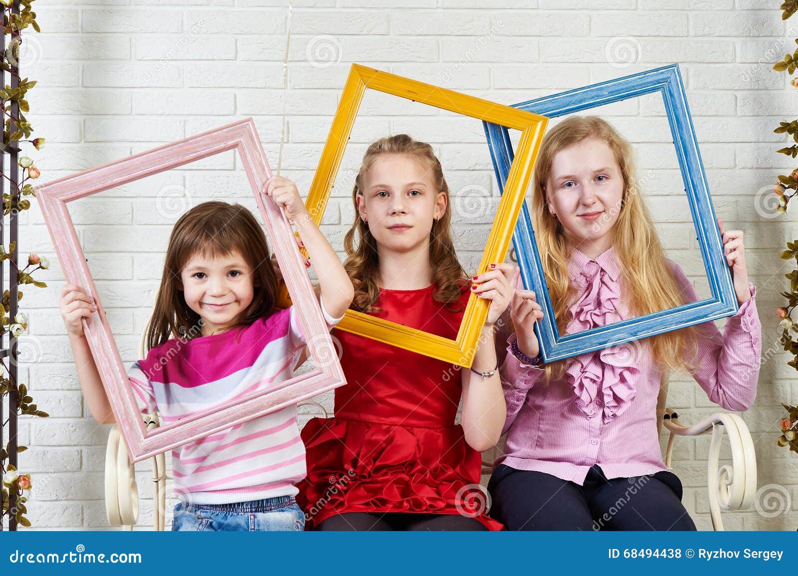 Three Girls with Frames of Paintings Stock Photo - Image of family ...