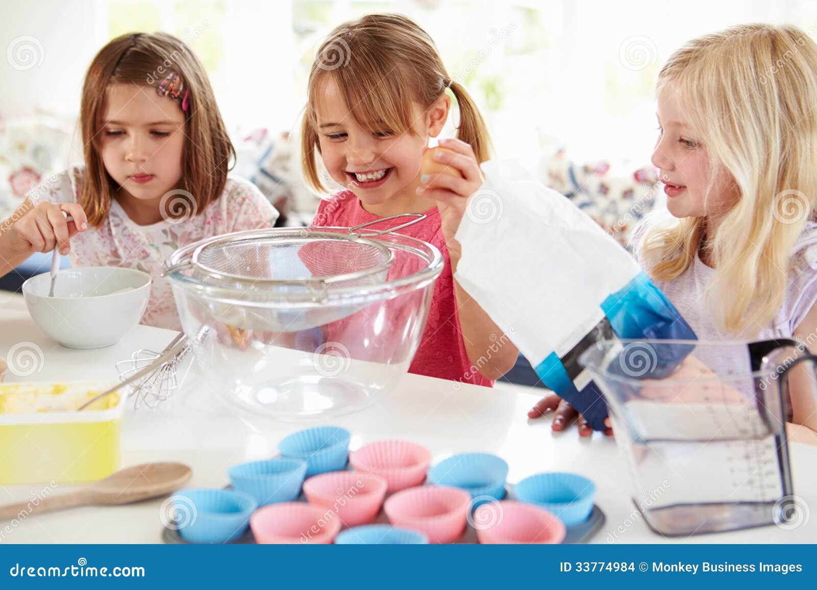 Three Girls Making Cupcakes in Kitchen Stock Photo - Image of friends ...