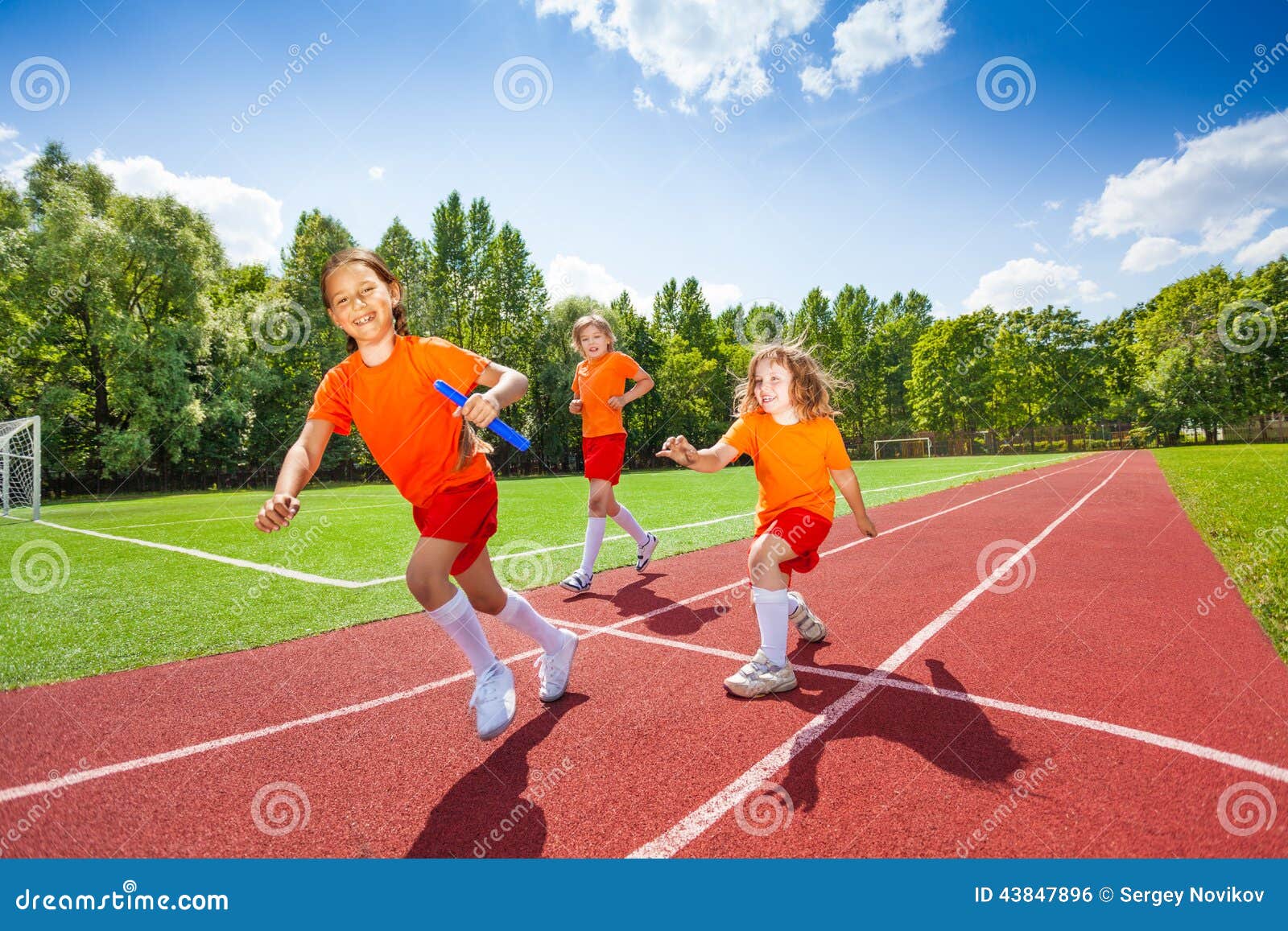 Three Girls with One Relay Baton Running Stock Photo - Image of ...