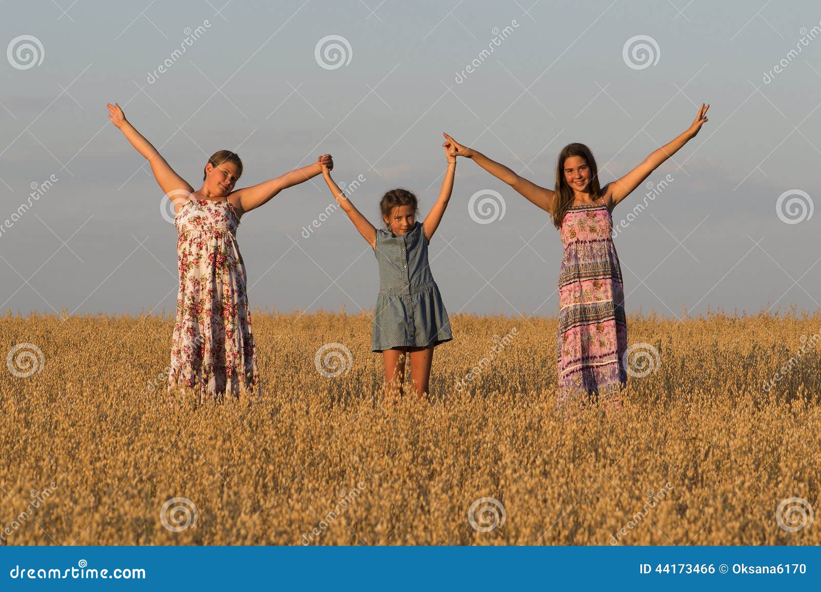 Three girls put hands up. stock photo. Image of group - 44173466