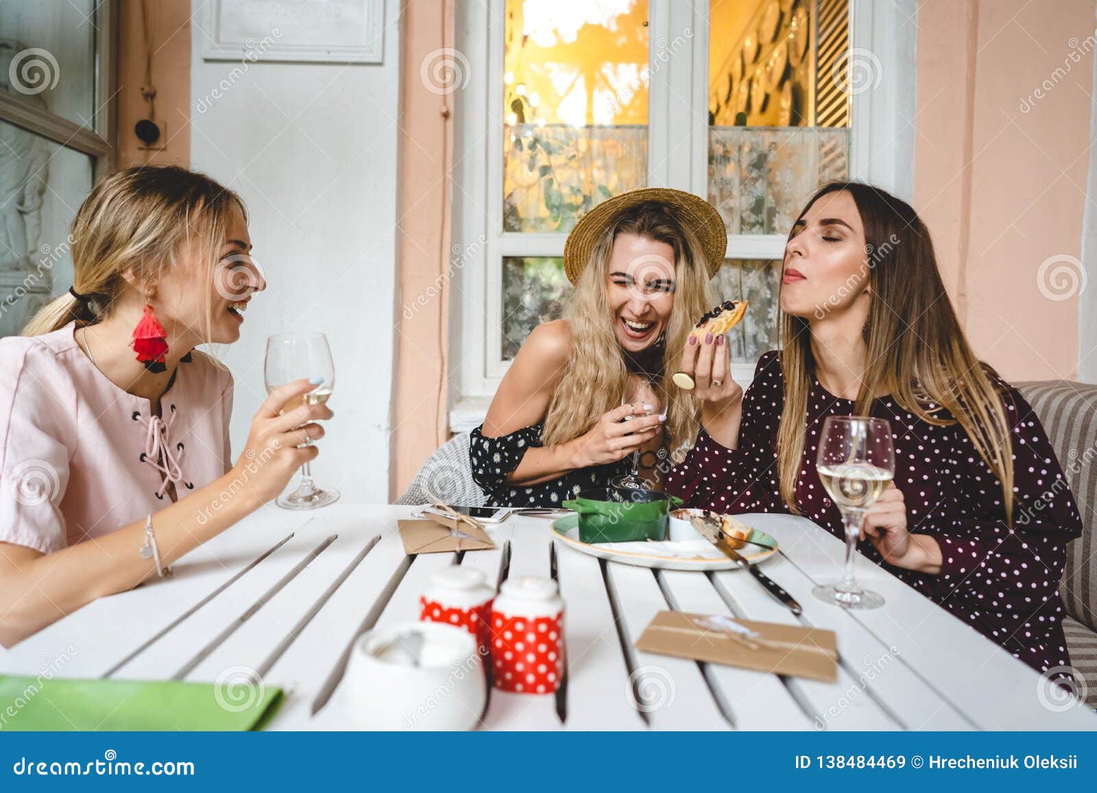 Three girls at the table stock image. Image of lifestyle - 138484469