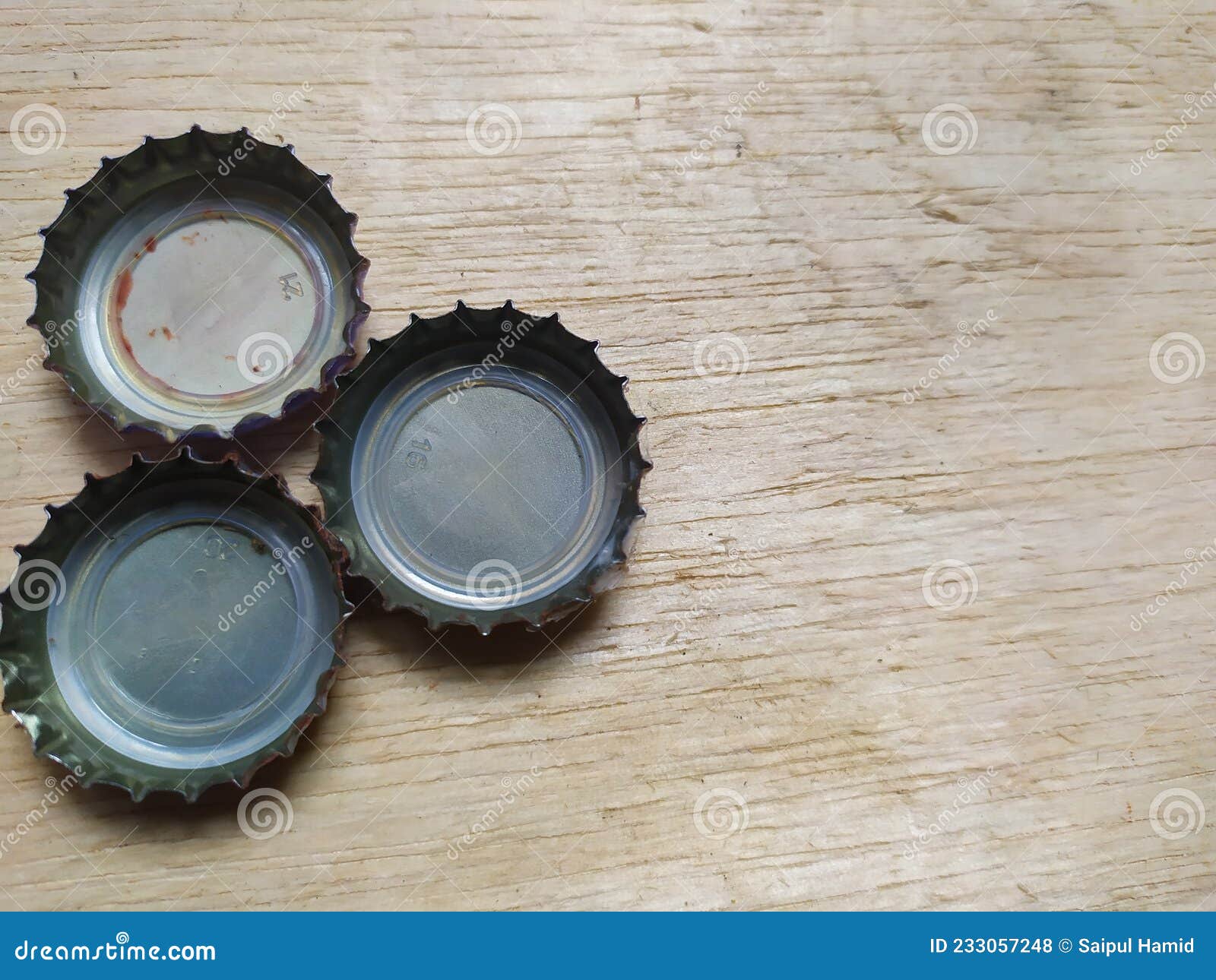 Three Glass Bottle Caps Arranged in a Triangle Stock Photo - Image of ...