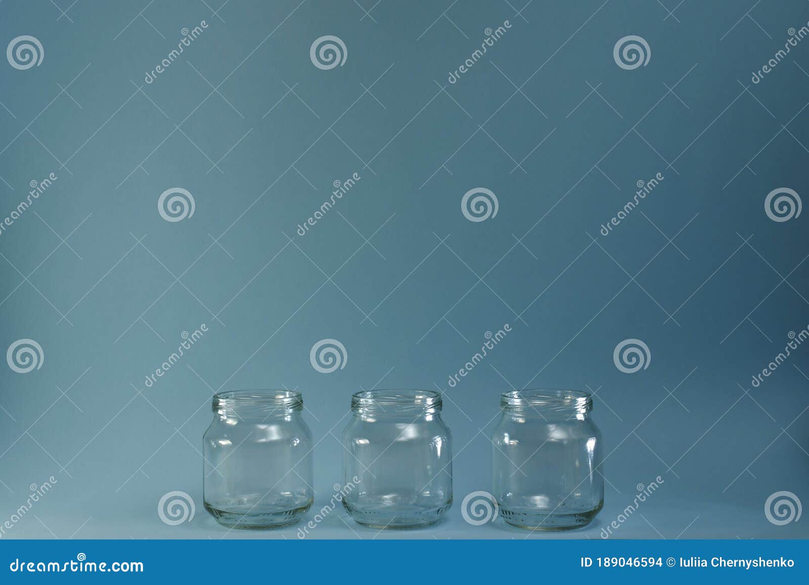 Three Glass Jars at the Bottom of the Center Horizontal Row. Stock ...