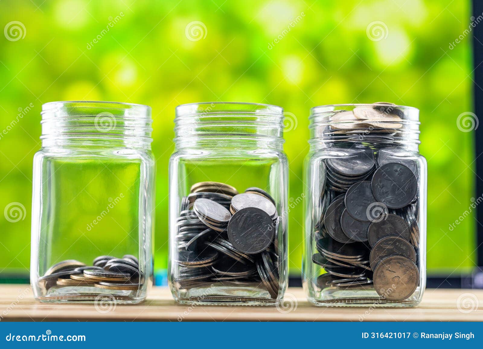 Three Glass Jars Containing Coins - Money-saving Concept Stock Image ...