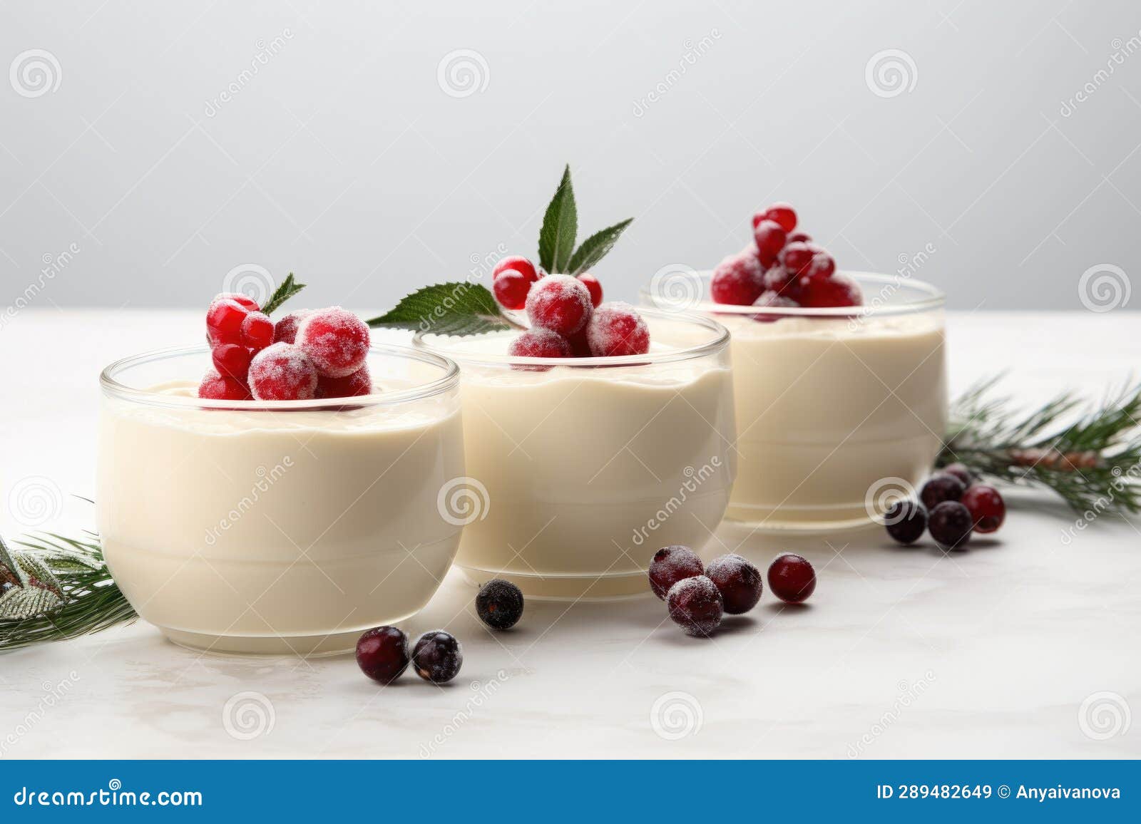 Three Glasses of Panna Cotta Pudding with Cranberries on a Table. Stock ...