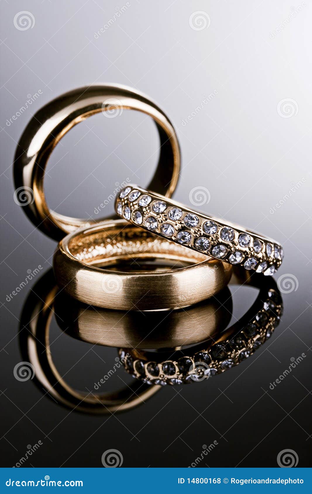 Three gold rings. stock photo. Image of metal, dark, design - 14800168
