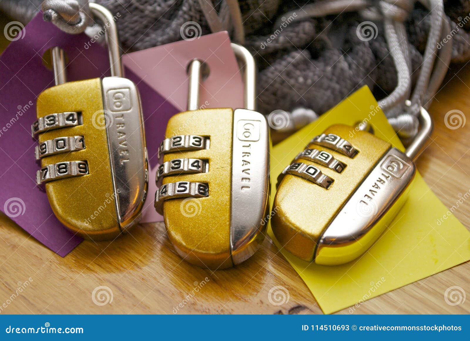 Three Gold-and-silver Combination Padlocks Picture. Image: 114510693