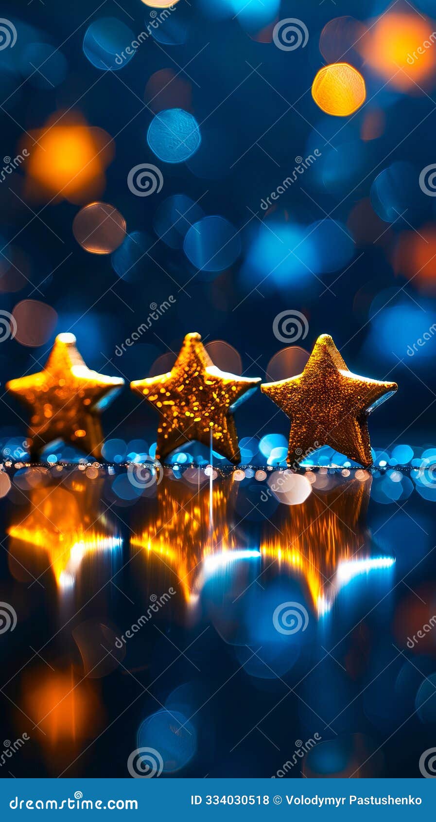 Three Gold Stars on a Blue Background with Bokeh Lights Stock Photo ...