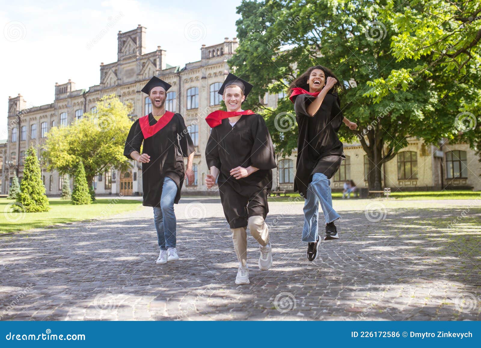 Three Graduates Running in the Park and Having Fun Stock Photo - Image ...