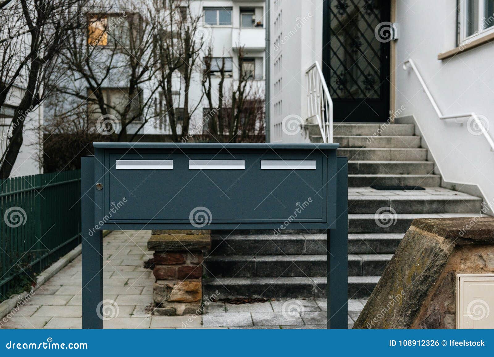 Three Gray Mailboxes In Front Of Modern House Stock Photo - Image of ...