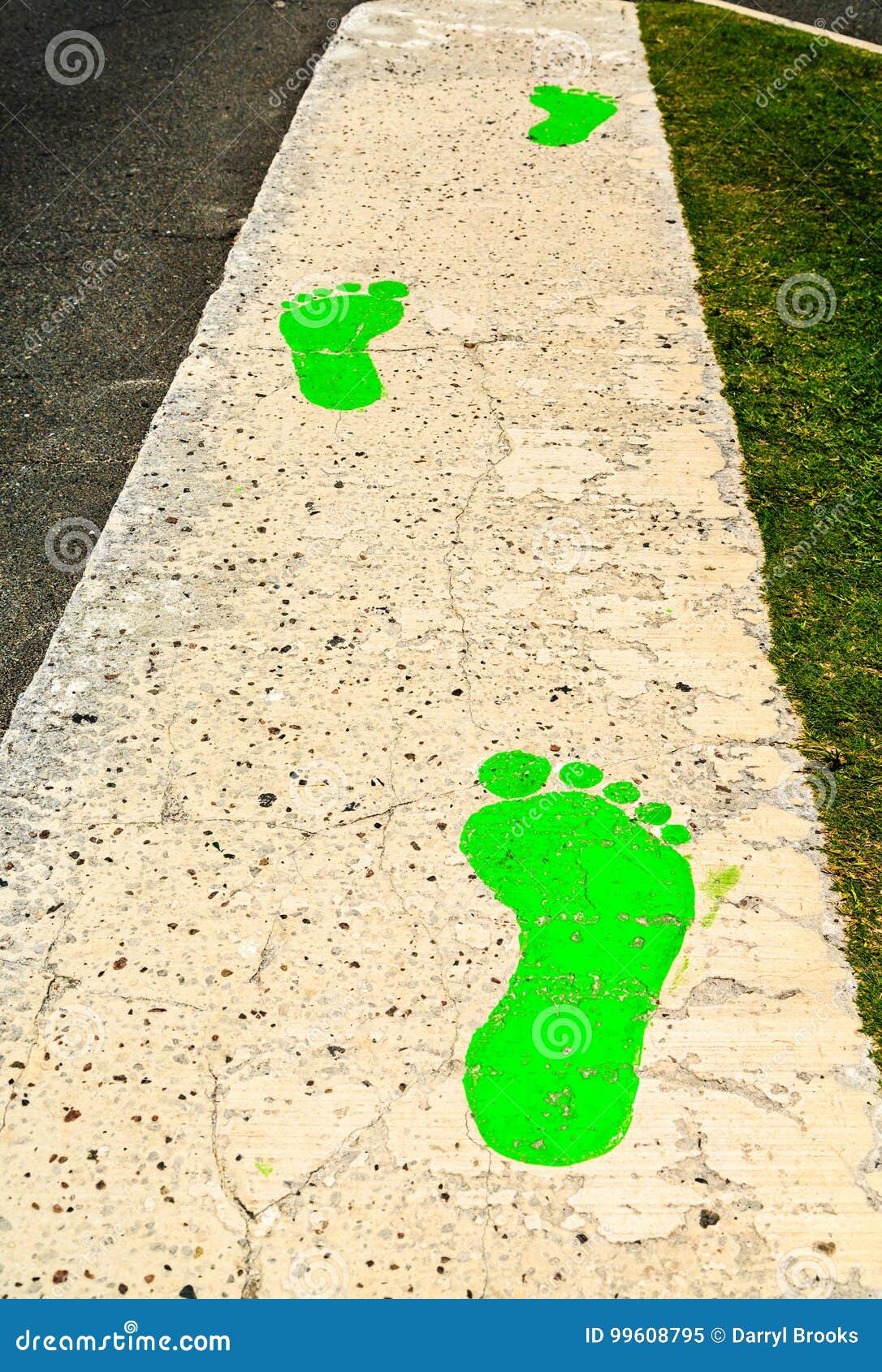 Green Footsteps on Sidewalk Stock Image - Image of path, feet: 99608795