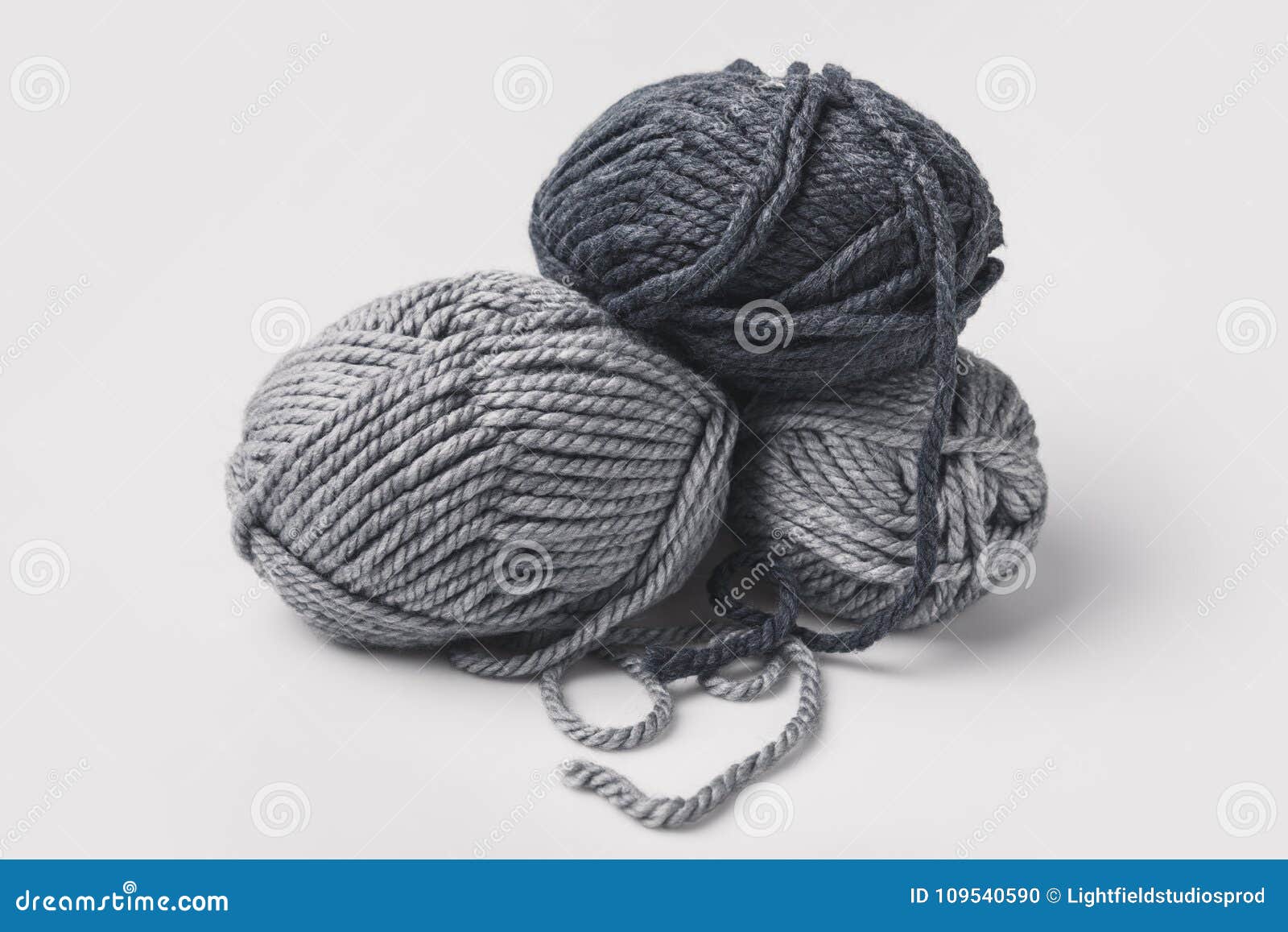 Three grey yarn balls stock photo. Image of thread, handcraft - 109540590