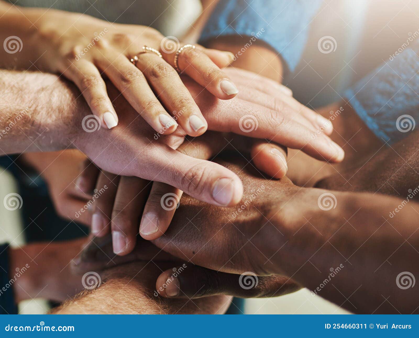 On Three...a Group of Creative Businesspeople Standing with Their Hands ...