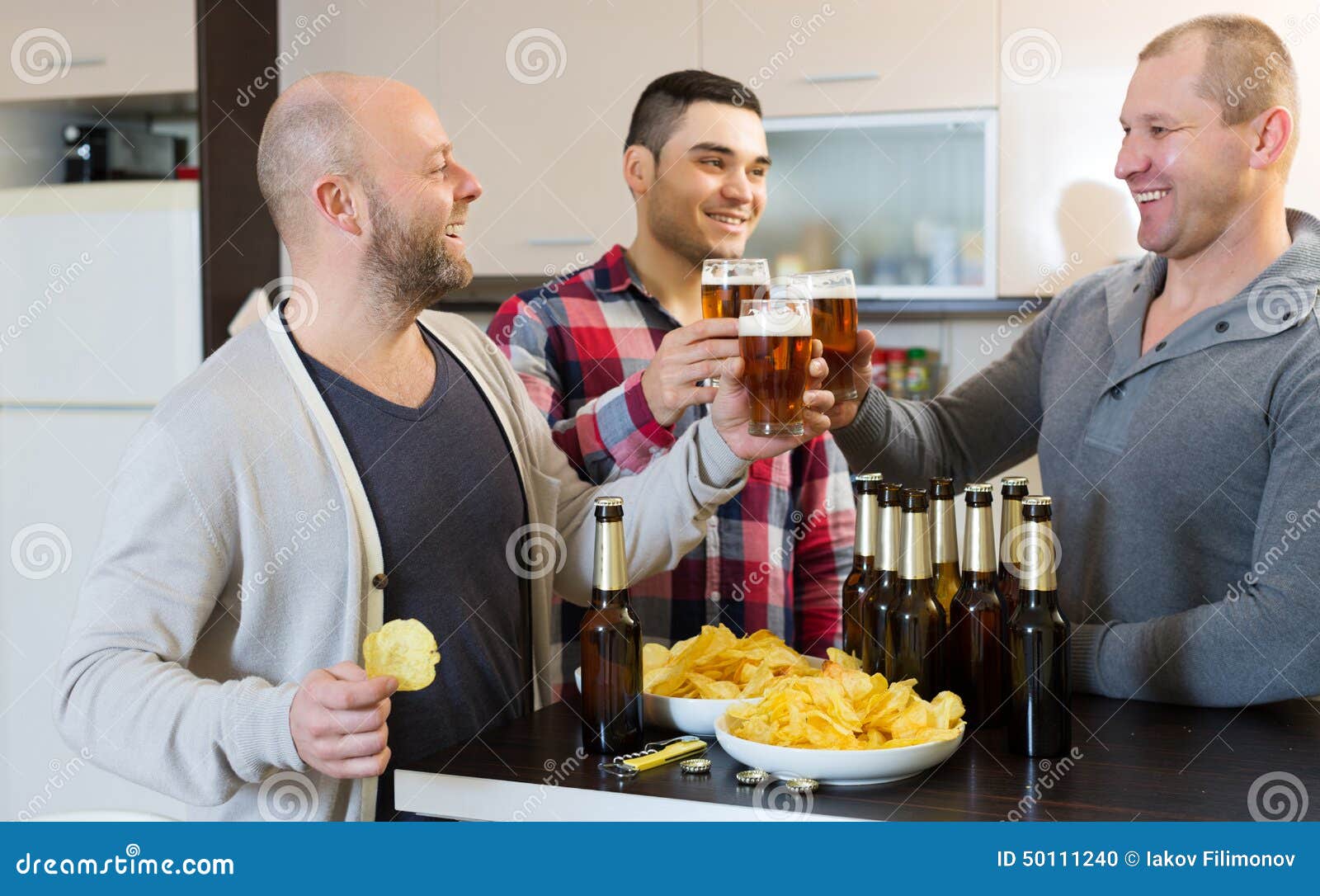 Three guys at house party stock photo. Image of caucasian - 50111240