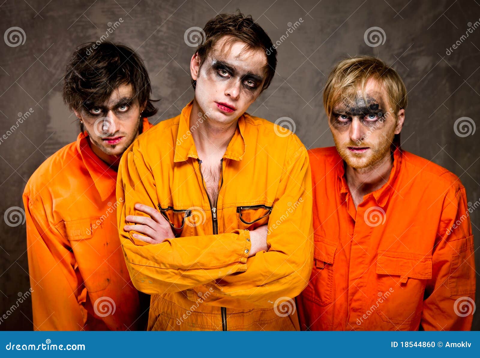 Three Guys in Orange Uniforms Stock Photo - Image of group, caucasian ...
