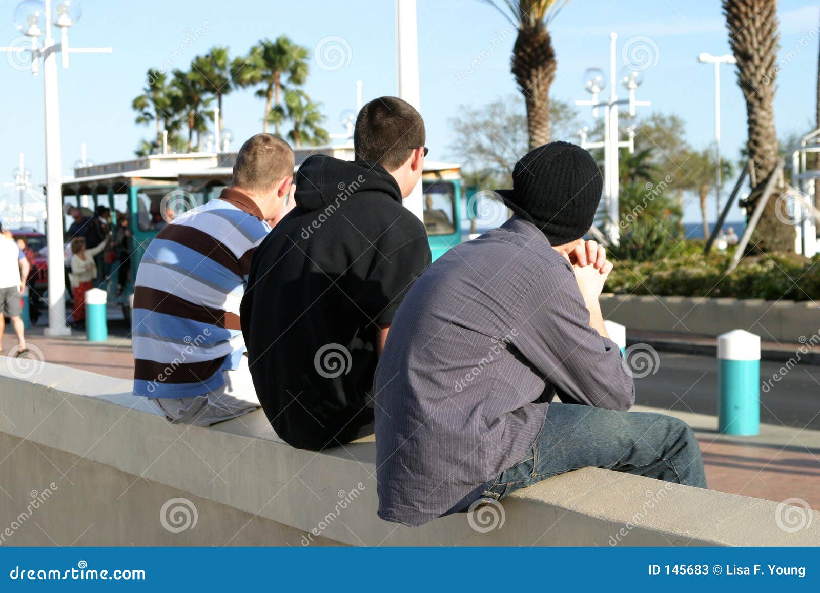 Three Guys on a Wall editorial stock photo. Image of group - 145683