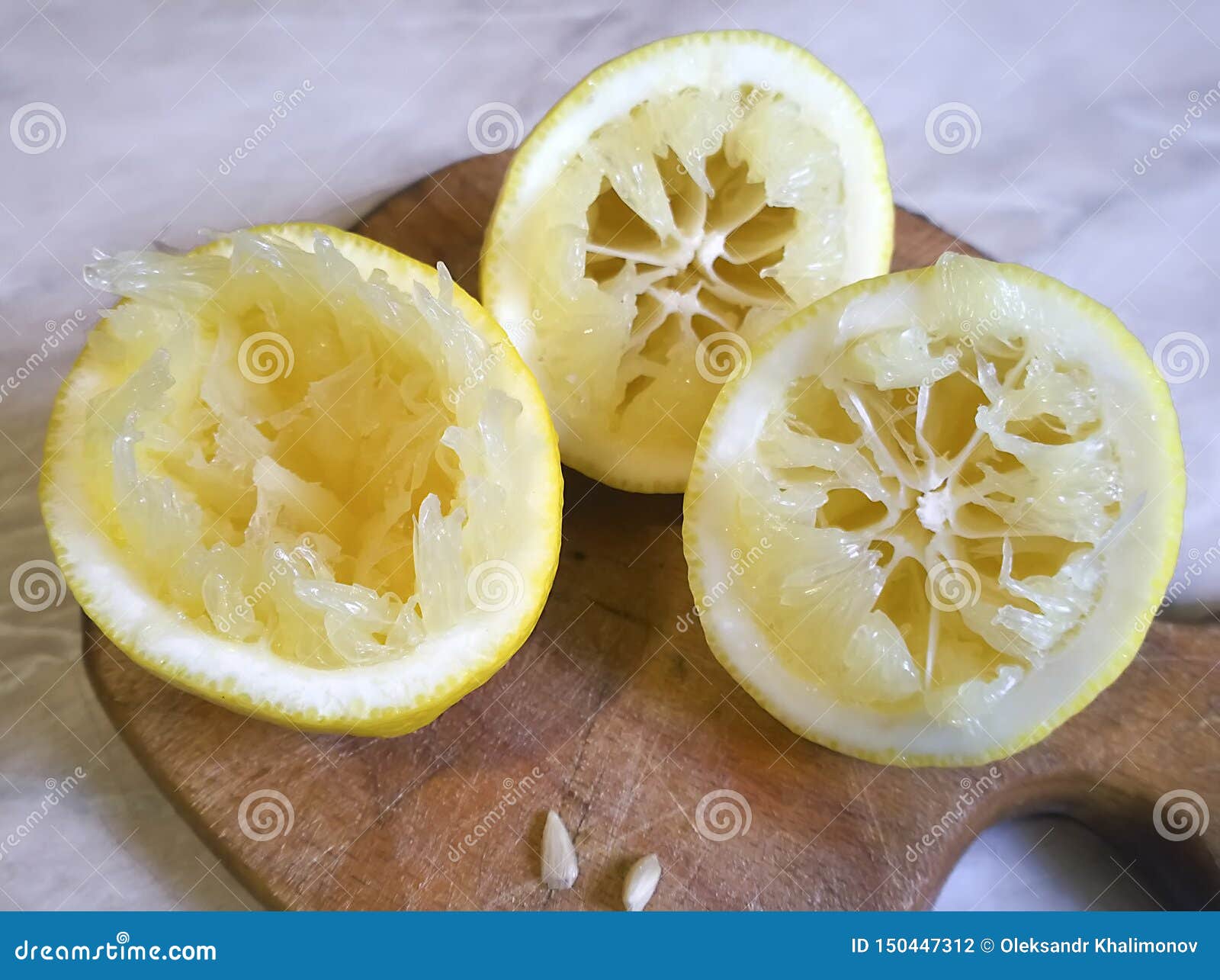 Three half squeezed lemon stock photo. Image of yellow - 150447312