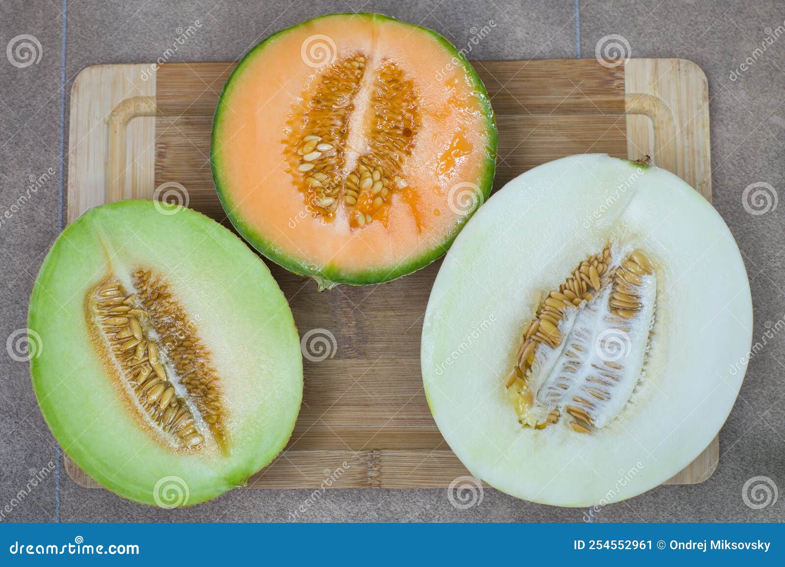 Three halved melons stock image. Image of fresh, isolated - 254552961